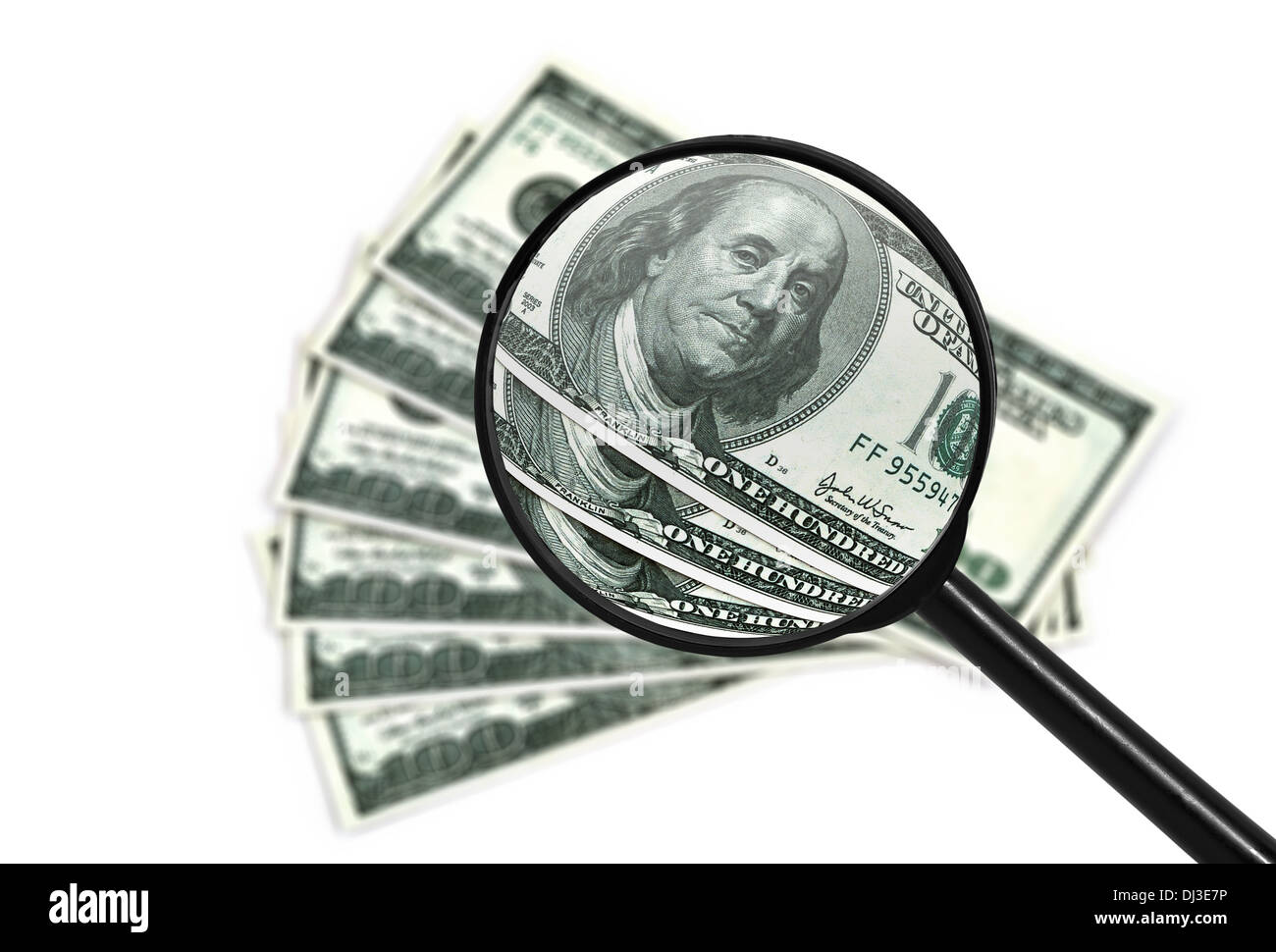 Money and black magnifying glass Stock Photo - Alamy