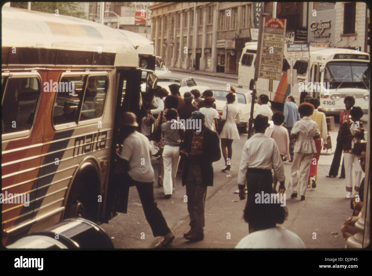 This photograph shows passengers boarding a Metropolitan Atlanta Rapid ...