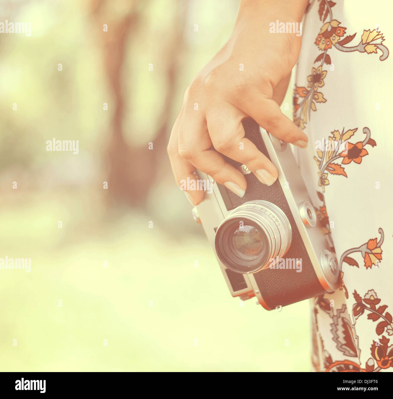 Woman hand holding retro camera close-up Stock Photo - Alamy