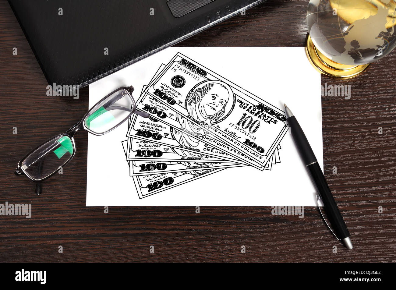 Modern workplace with drawing dollars on paper Stock Photo - Alamy