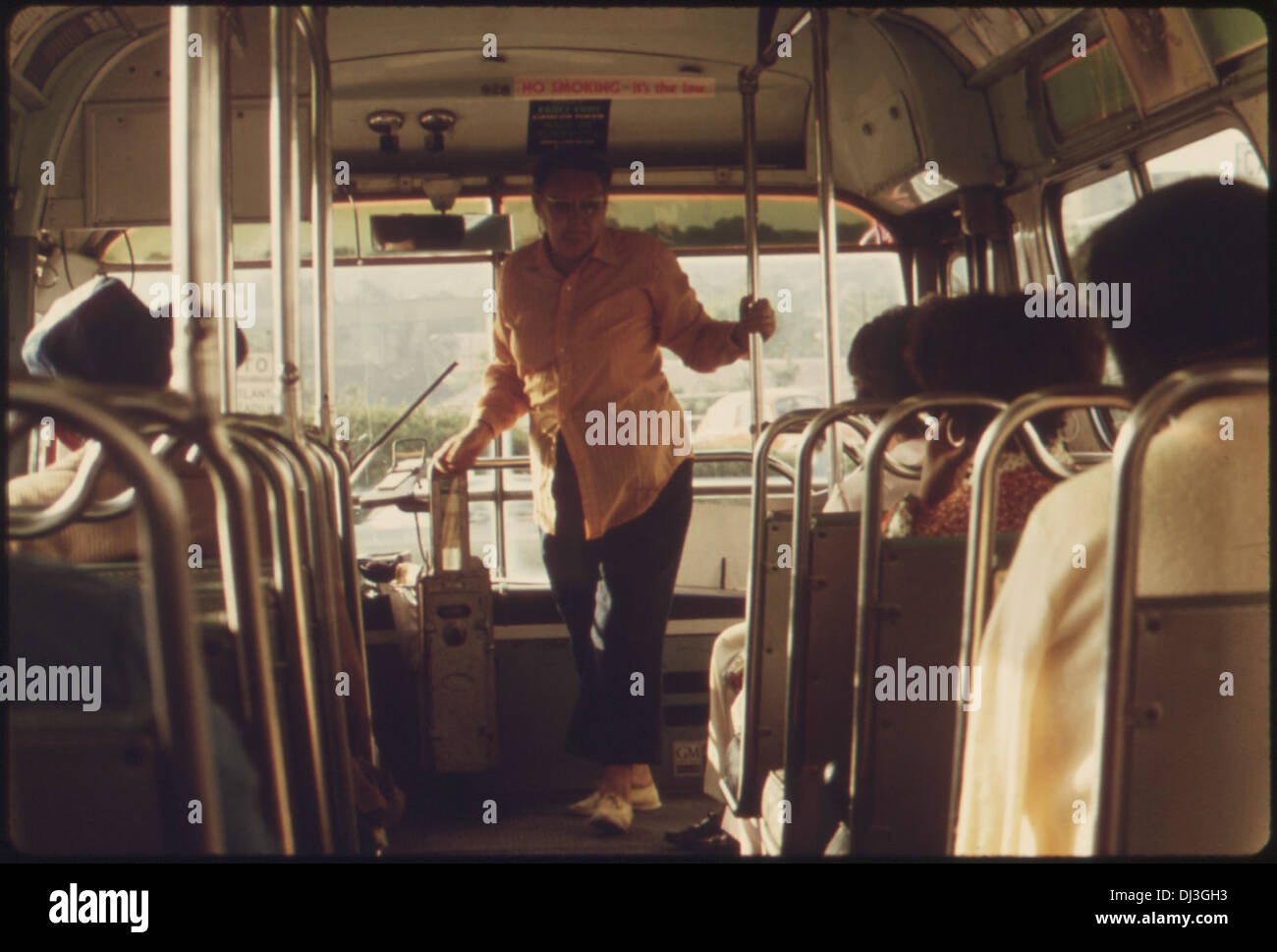A passenger is seen heading towards an available seat on a MARTA bus in ...