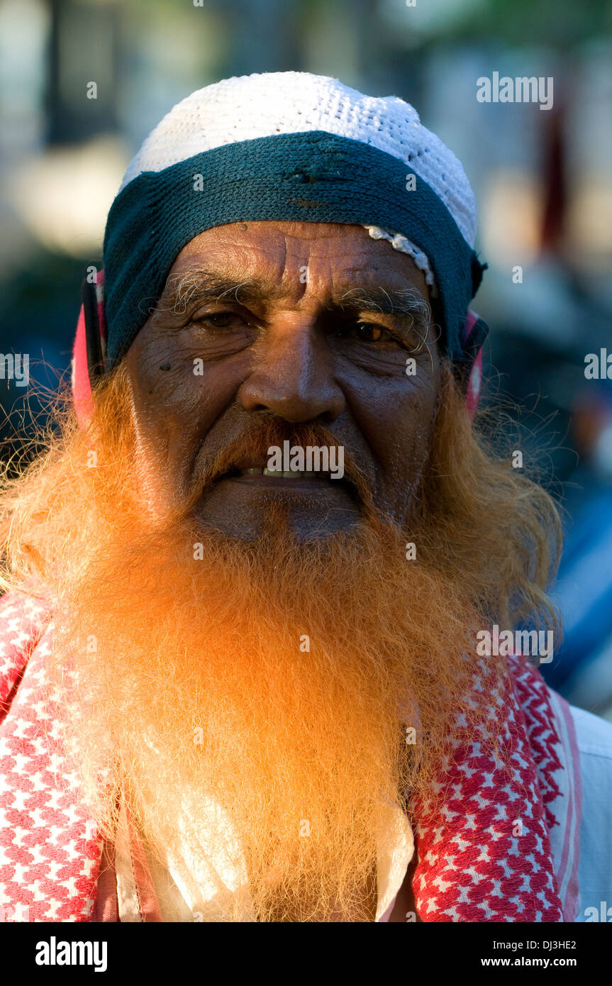 Indian Muslim pilgrim at Sri Ramana Ashram with traditional henna beard ...