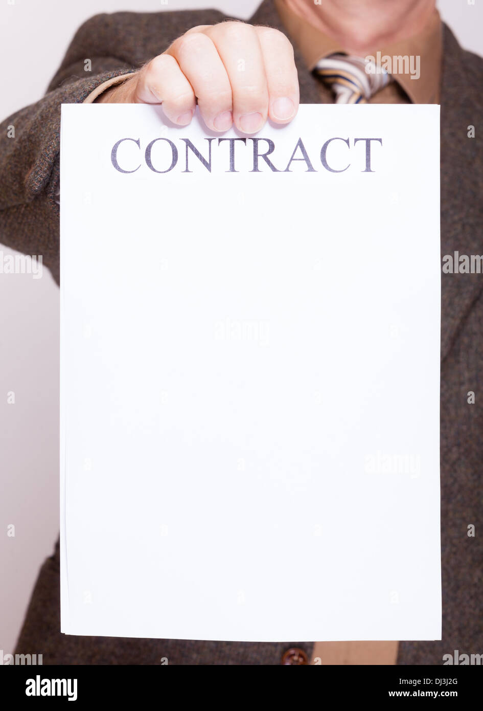 Business concept. Businessman holding blank empty paper sheet with sign ...