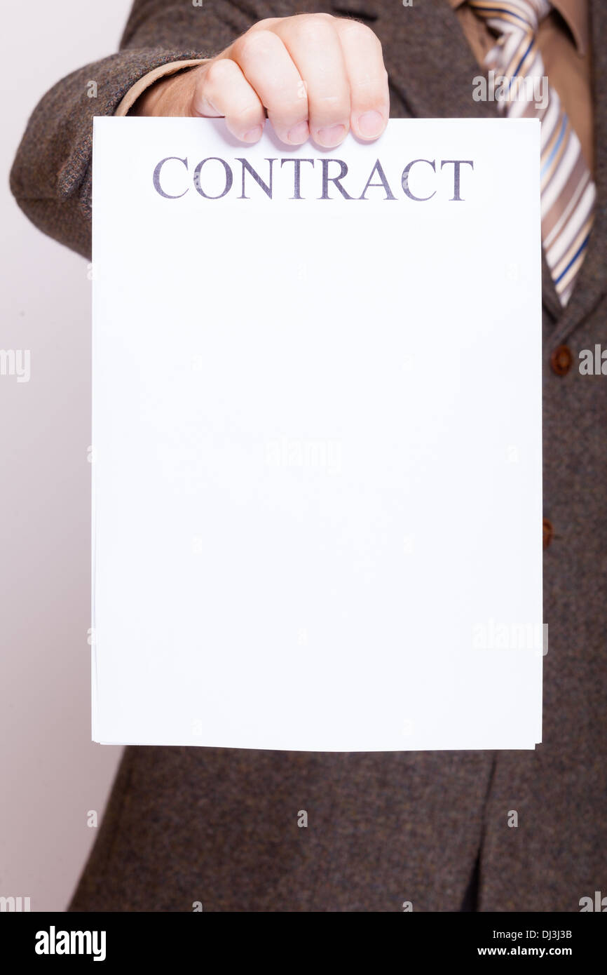 Business concept. Businessman holding blank empty paper sheet with sign ...