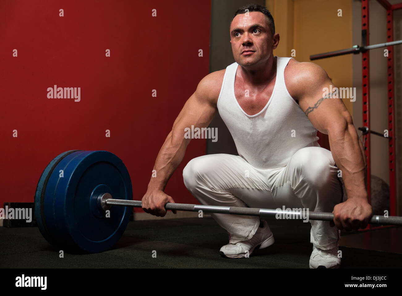 Bodybuilder preparing for deadlift of barbell Stock Photo - Alamy