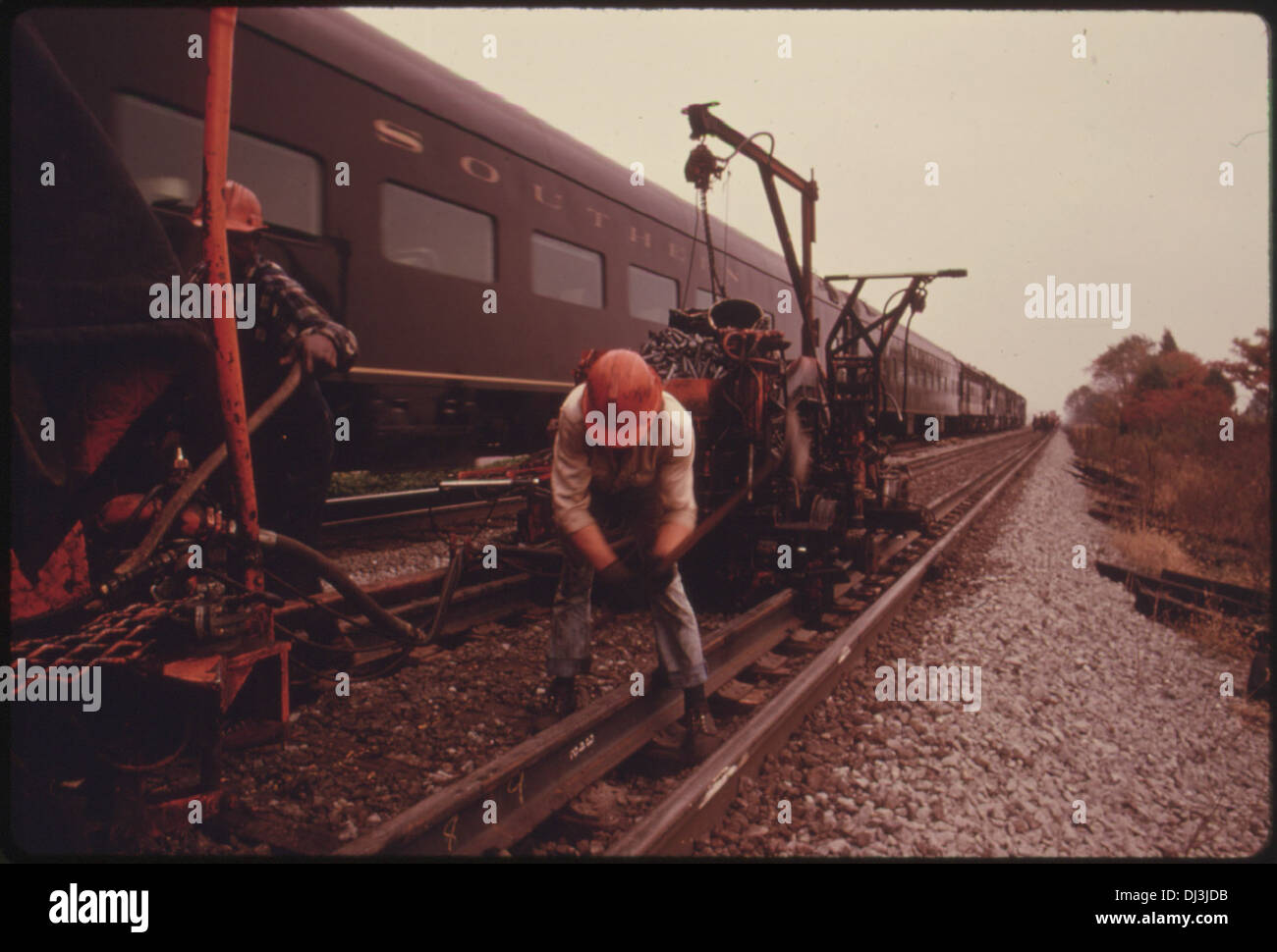 A Southern Railway repair crew replaces old rails with new quarter-mile ...