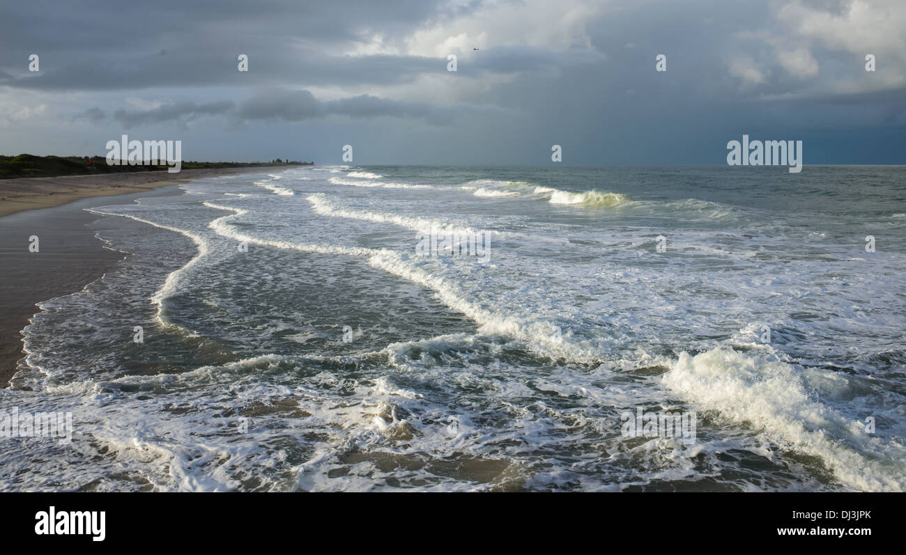 Beach in Florida with rainstorm approaching. Small single engine ...
