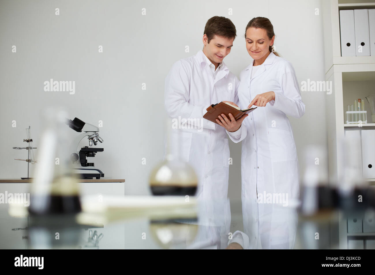Two scientists working in lab Stock Photo - Alamy