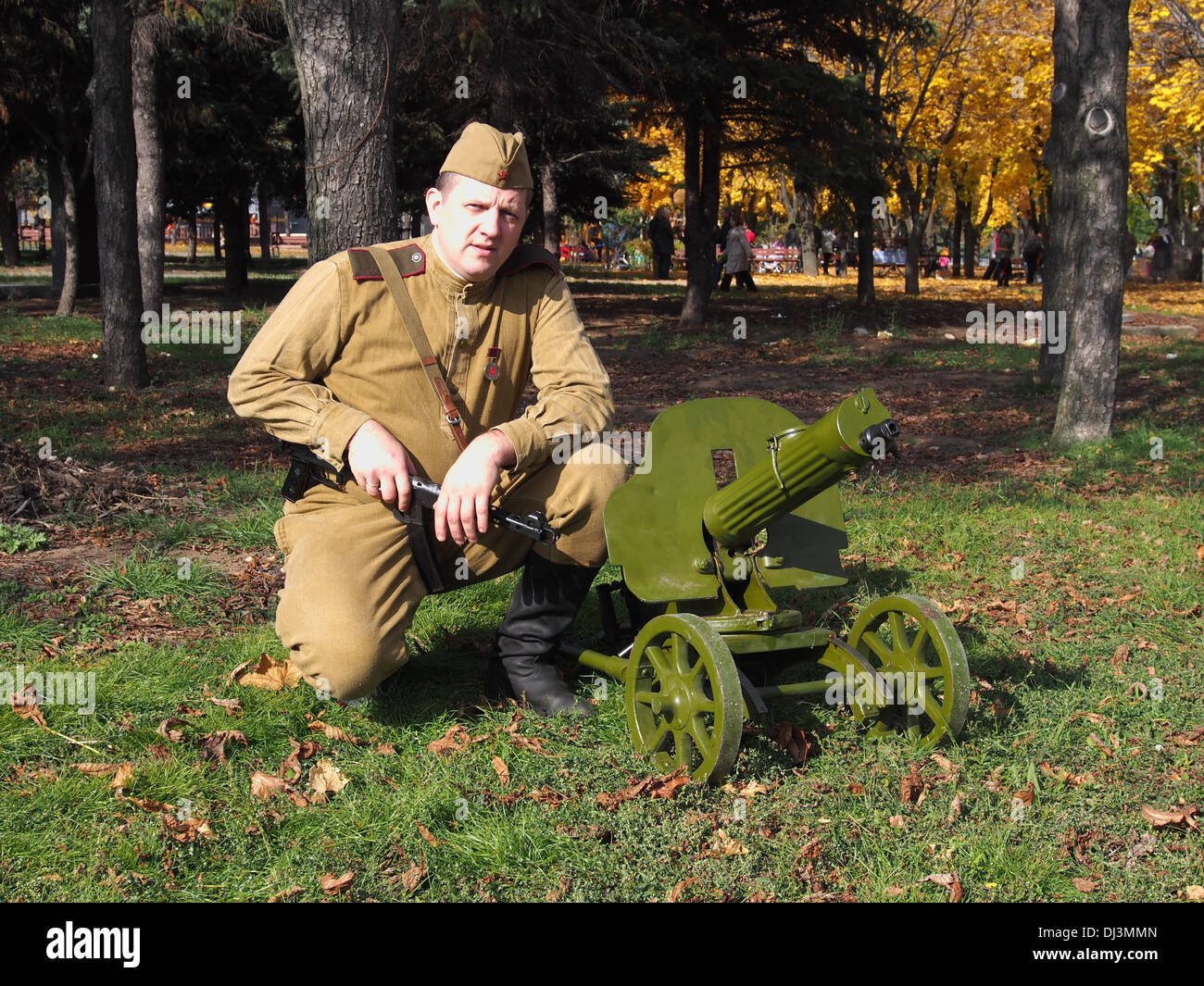 re-enactor in the form of a Red Army soldier with a machine gun Maxim ...