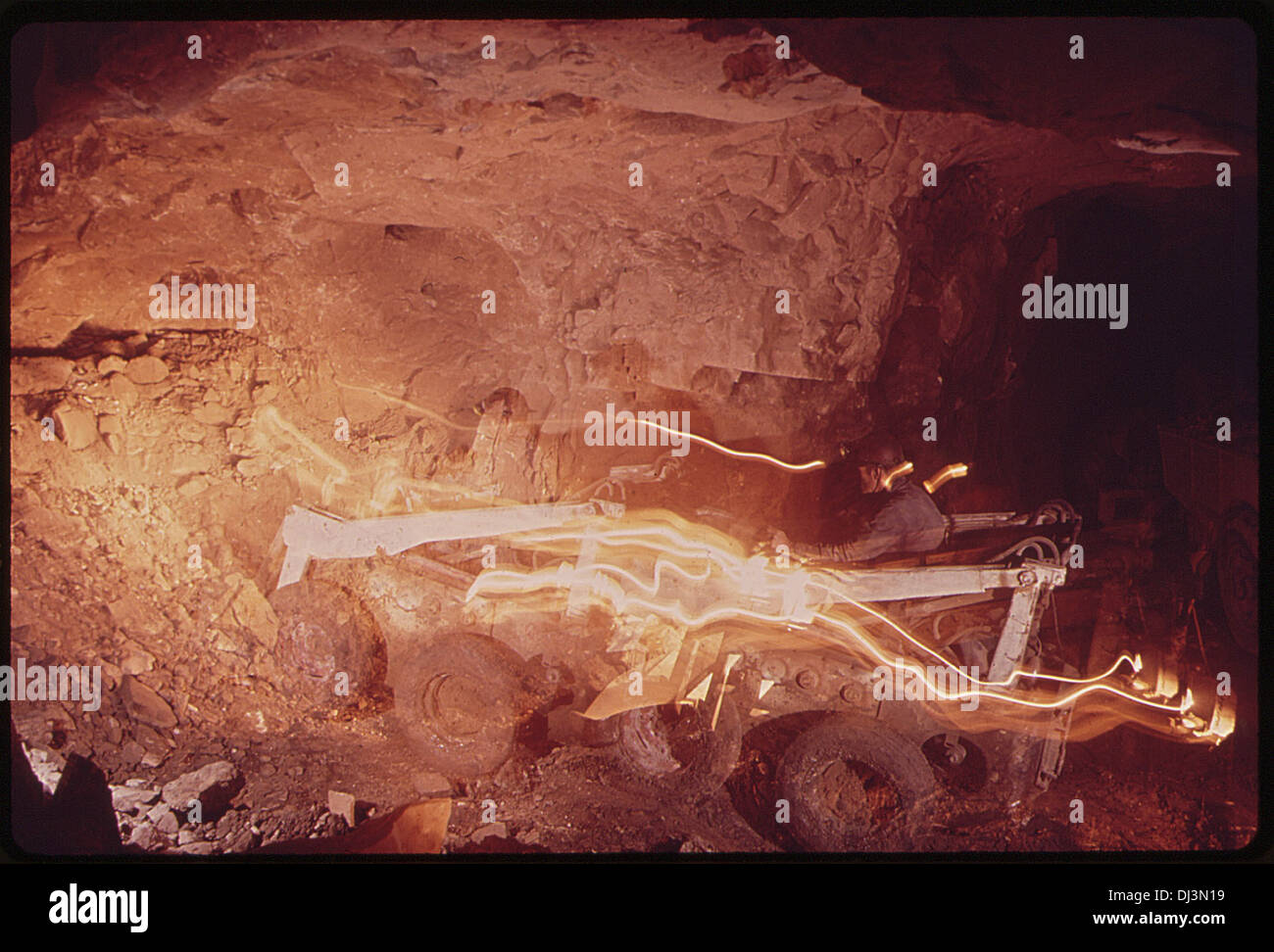 A time-exposure photograph of mining operations, capturing the dynamic ...