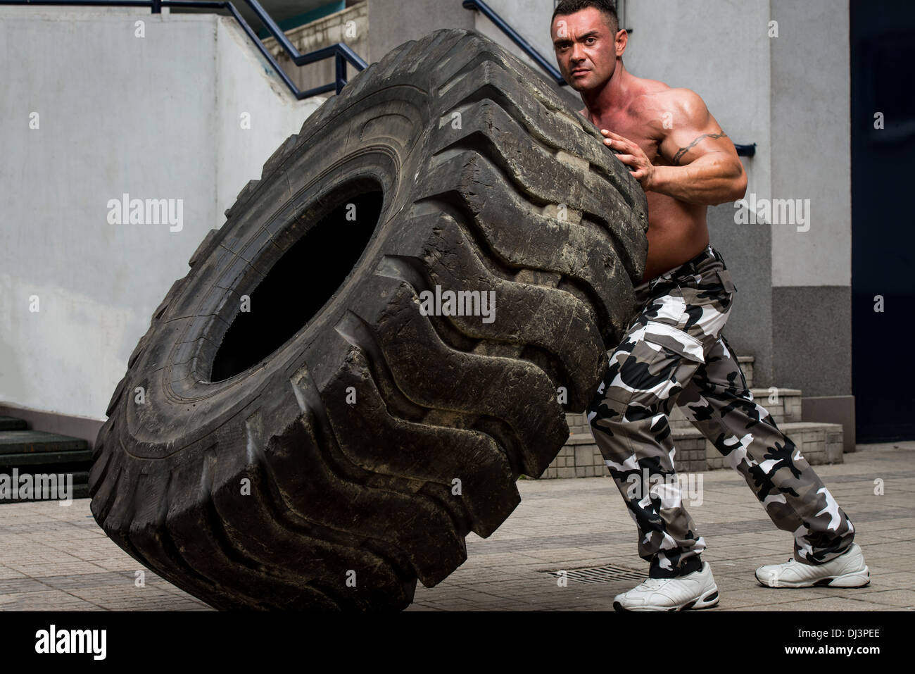 Men building tires hi-res stock photography and images - Alamy