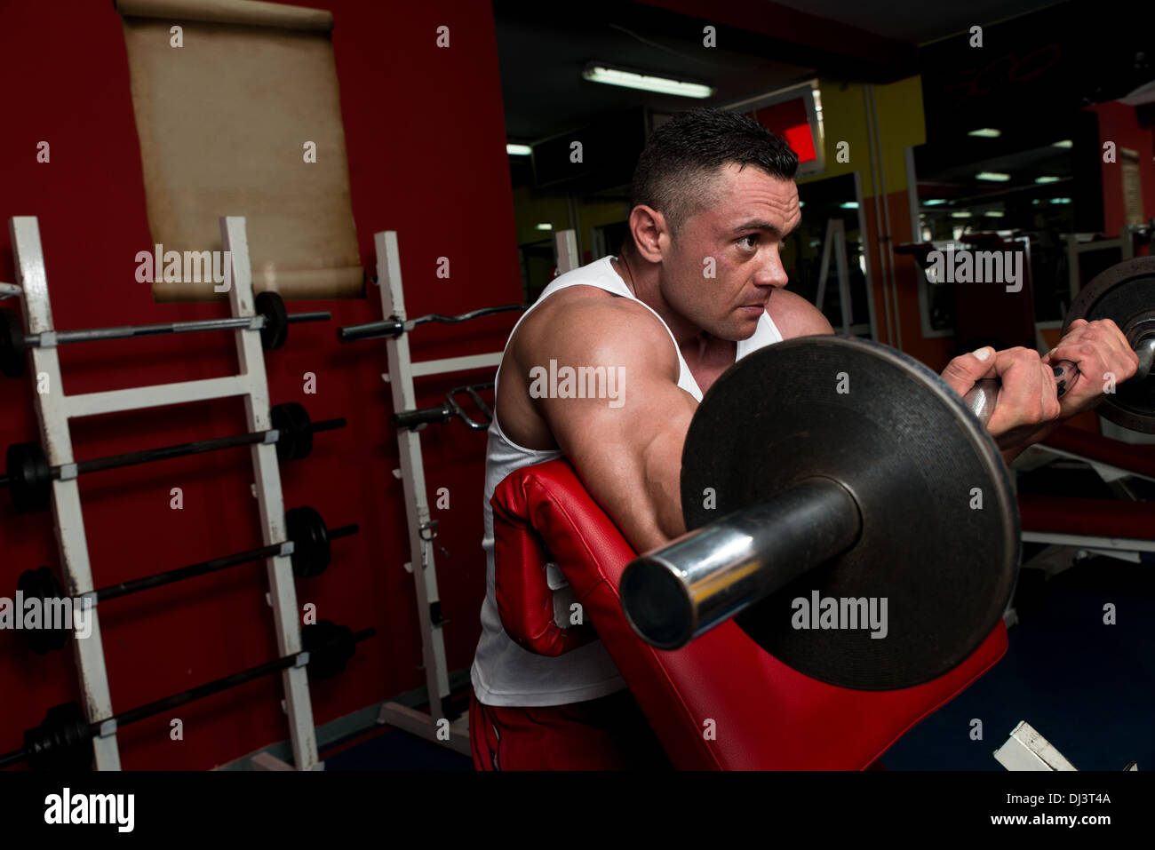 Bodybuilder Doing Heavy Barbell Exercise Stock Photo - Alamy