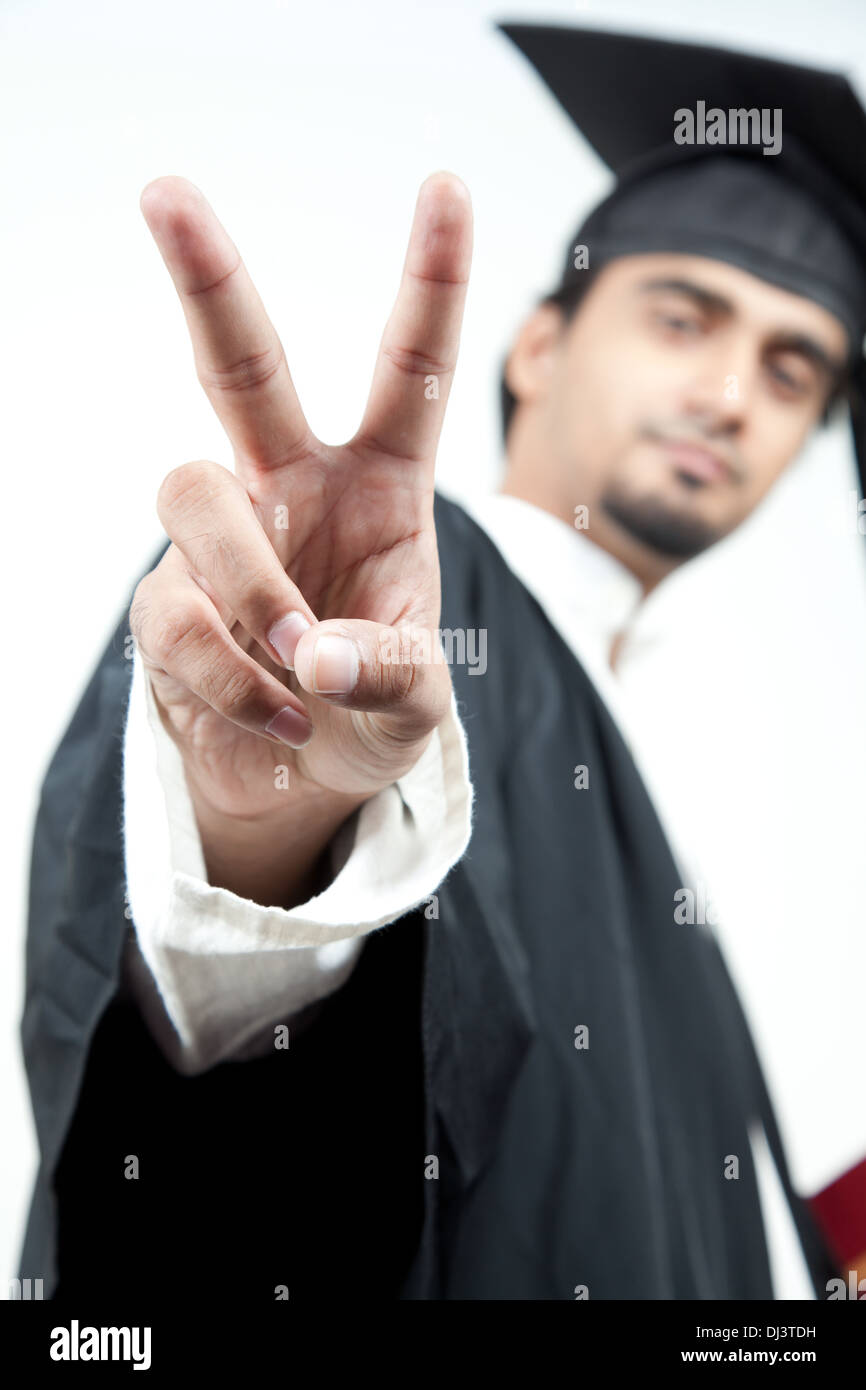 Asian student graduated posing victory symbol Stock Photo - Alamy