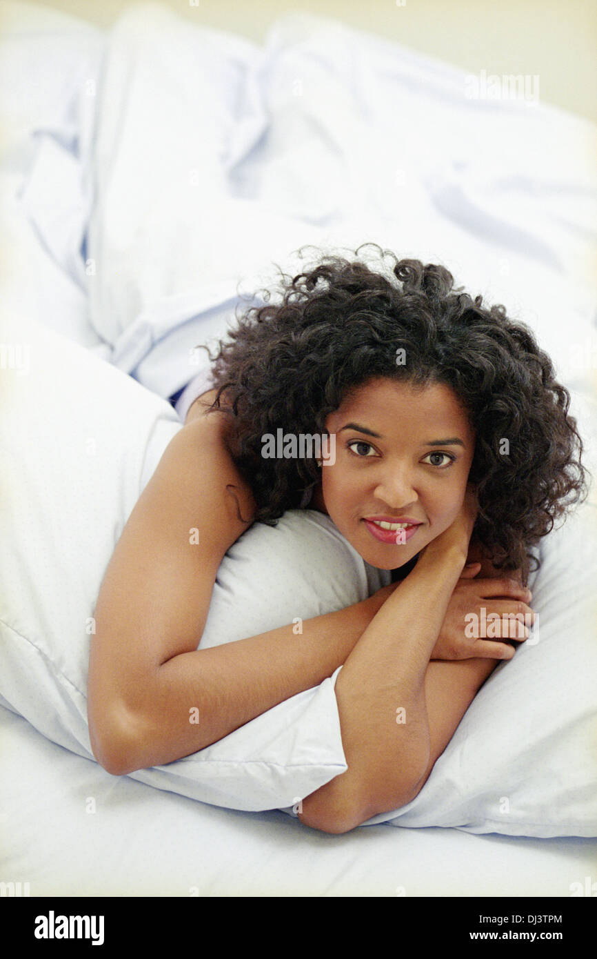 African american woman waking up in bed hi-res stock photography and ...