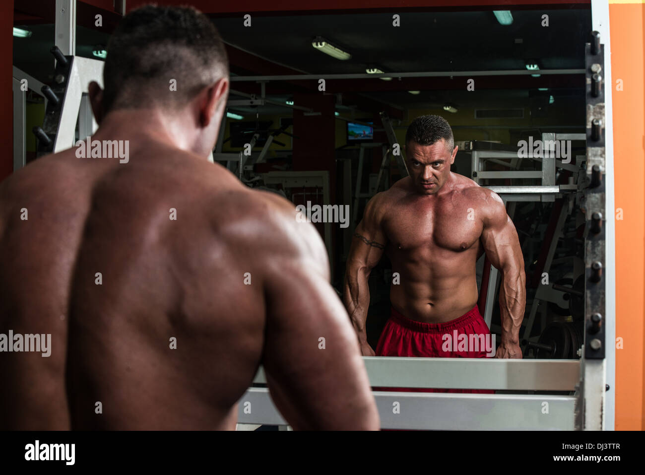 Man Doing Trap Exercises Stock Photo - Alamy