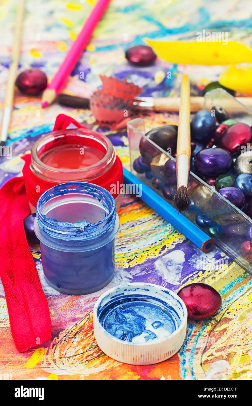 pencils,paint in different colors on the color palette Stock Photo - Alamy