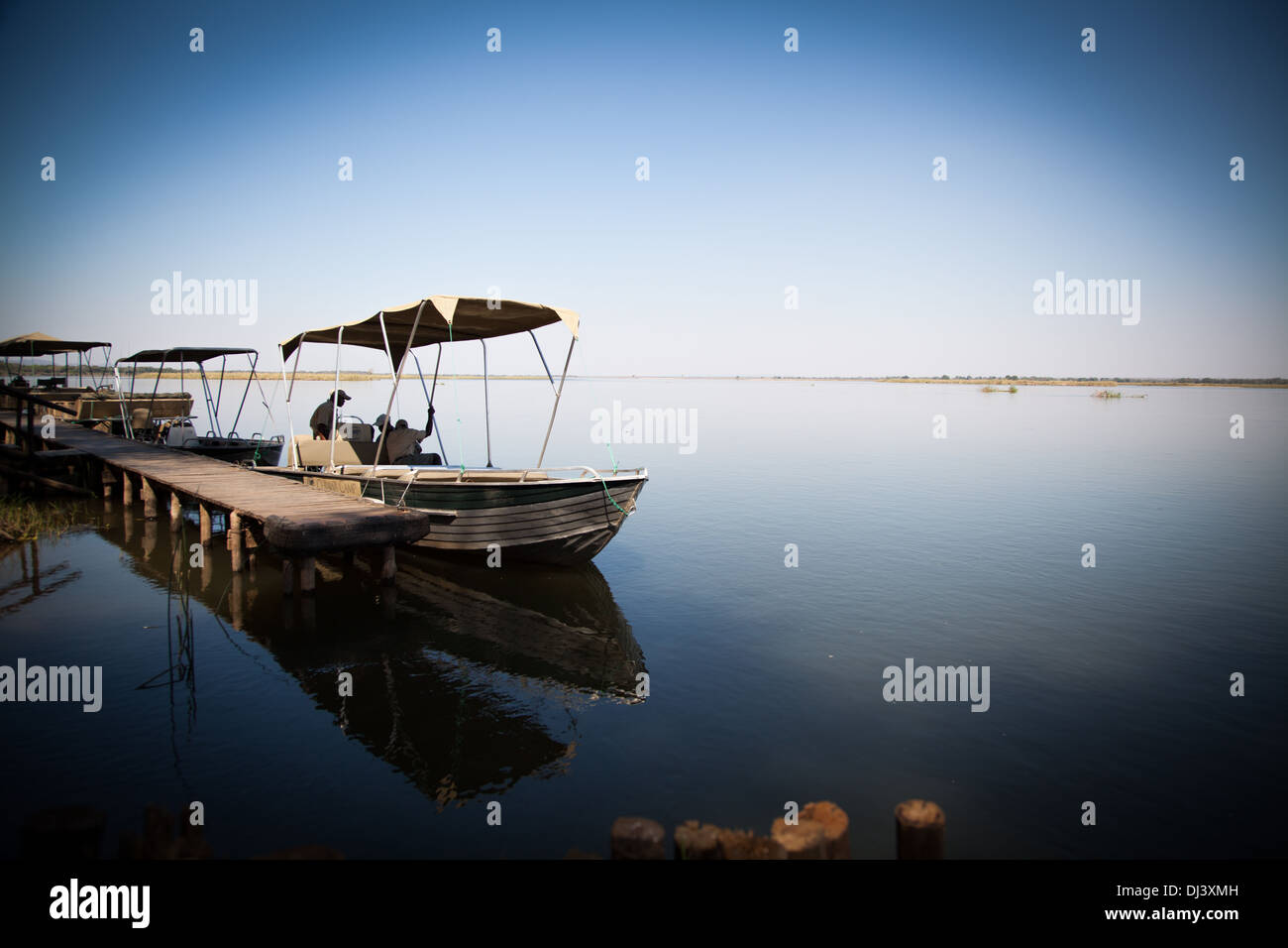 Boats on the Zambezi River, Zambia in Africa Stock Photo - Alamy