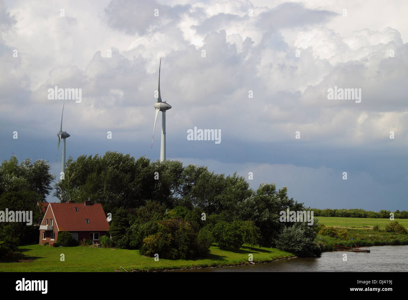 House and Wind Power Stock Photo - Alamy