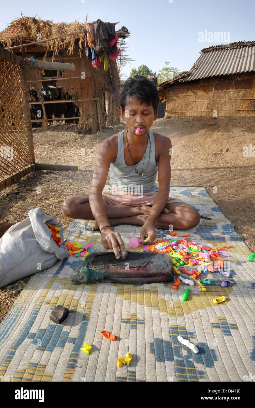 Dubla man making balloons, India Stock Photo - Alamy