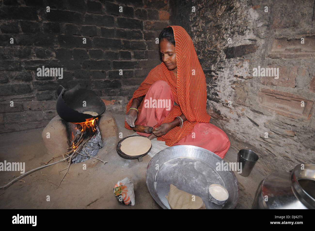 Tribal woman cooking food, India Stock Photo - Alamy