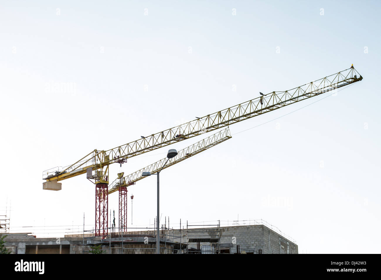 Crane on a construction site Stock Photo - Alamy