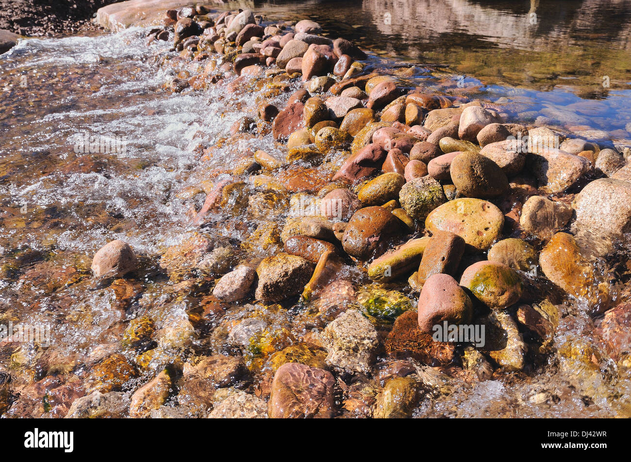 Stone barrier in water Stock Photo - Alamy