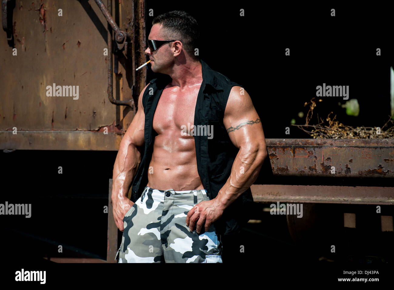 Bodybuilder Smoking A Cigar Stock Photo - Alamy