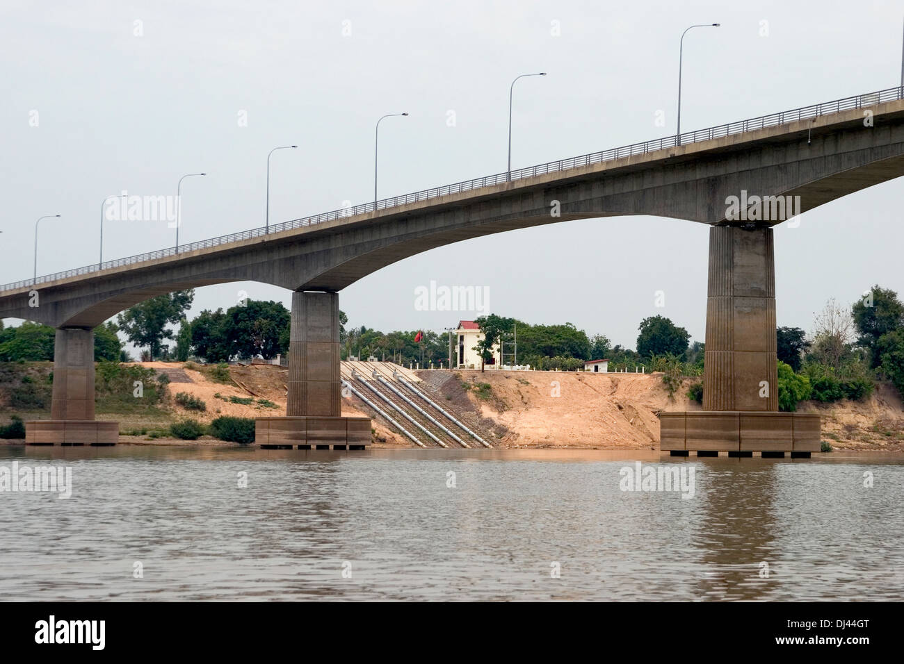 A bridge spans the Mekong river between Laos and Thailand in the border ...