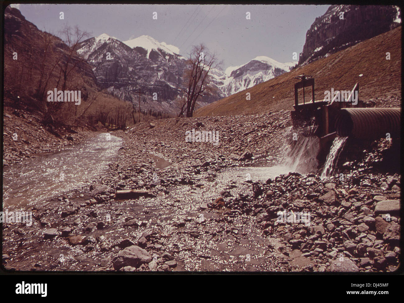 This image shows water leaking from the mine tailings pond at the ...