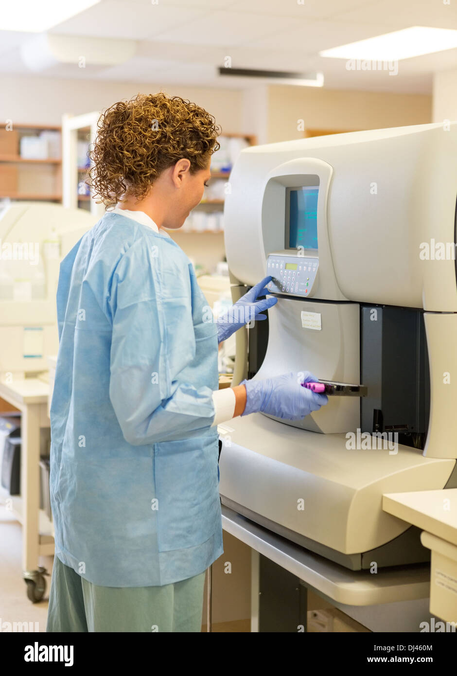 Female Lab Tech with Hematology Test Specimens Stock Photo - Alamy
