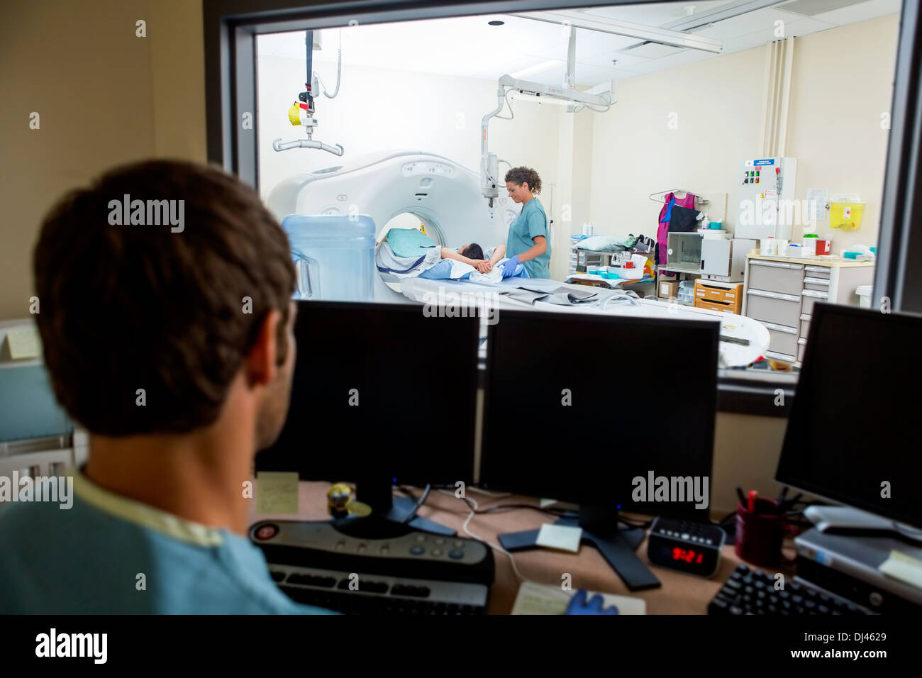 Radiologist Working In CT Scan Lab Stock Photo - Alamy
