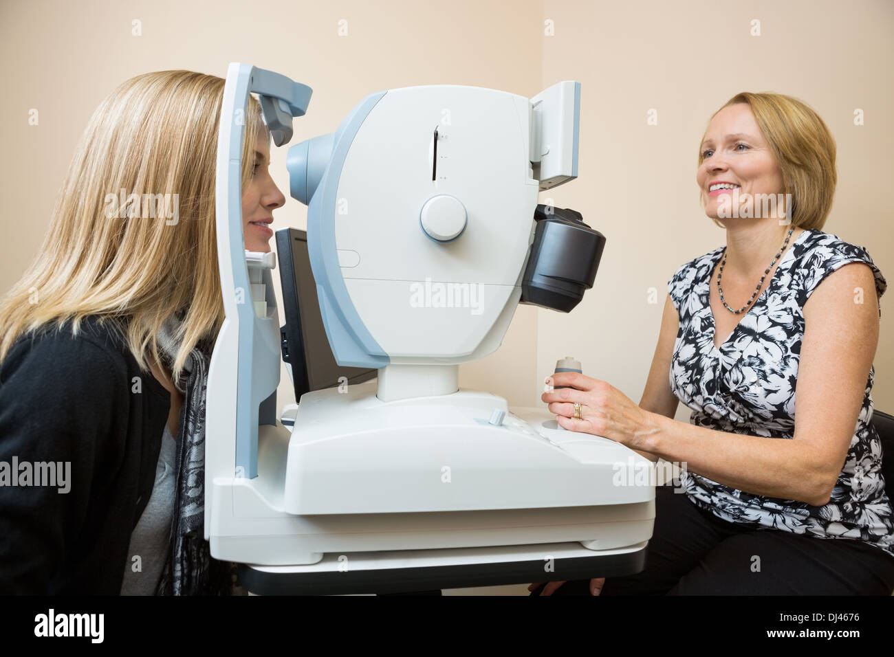Optician Examining Patient's Eye With Retina Camera Stock Photo - Alamy
