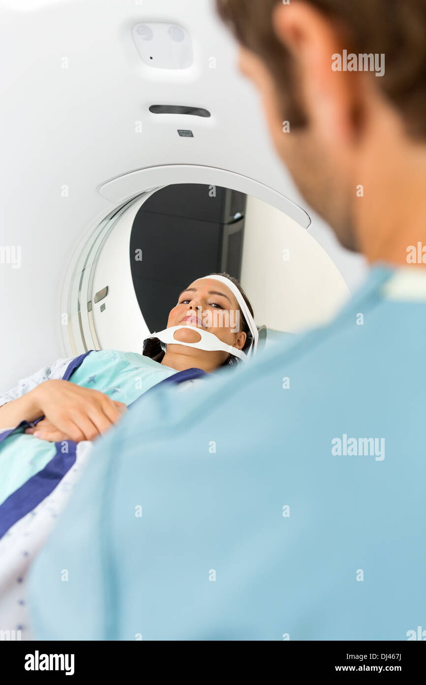 Patient Looking At Nurse While Undergoing CT Scan Stock Photo - Alamy