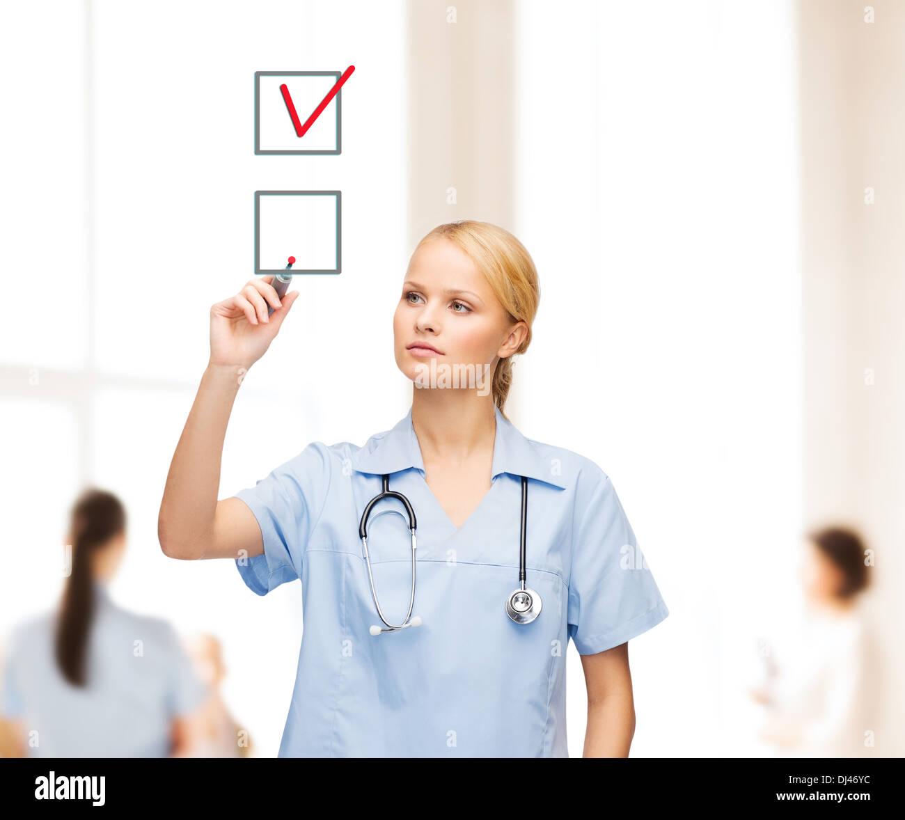 doctor or nurse drawning checkmark into checkbox Stock Photo - Alamy