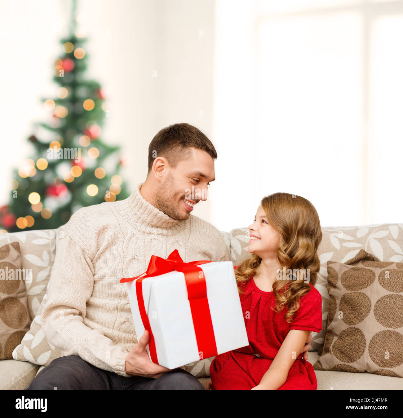 smiling father and daughter looking at each other Stock Photo - Alamy