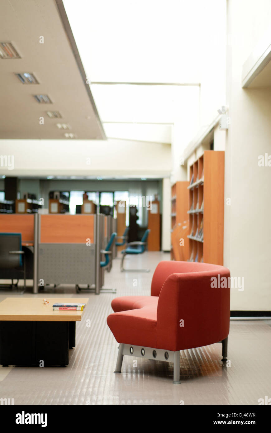 bench in library Stock Photo - Alamy