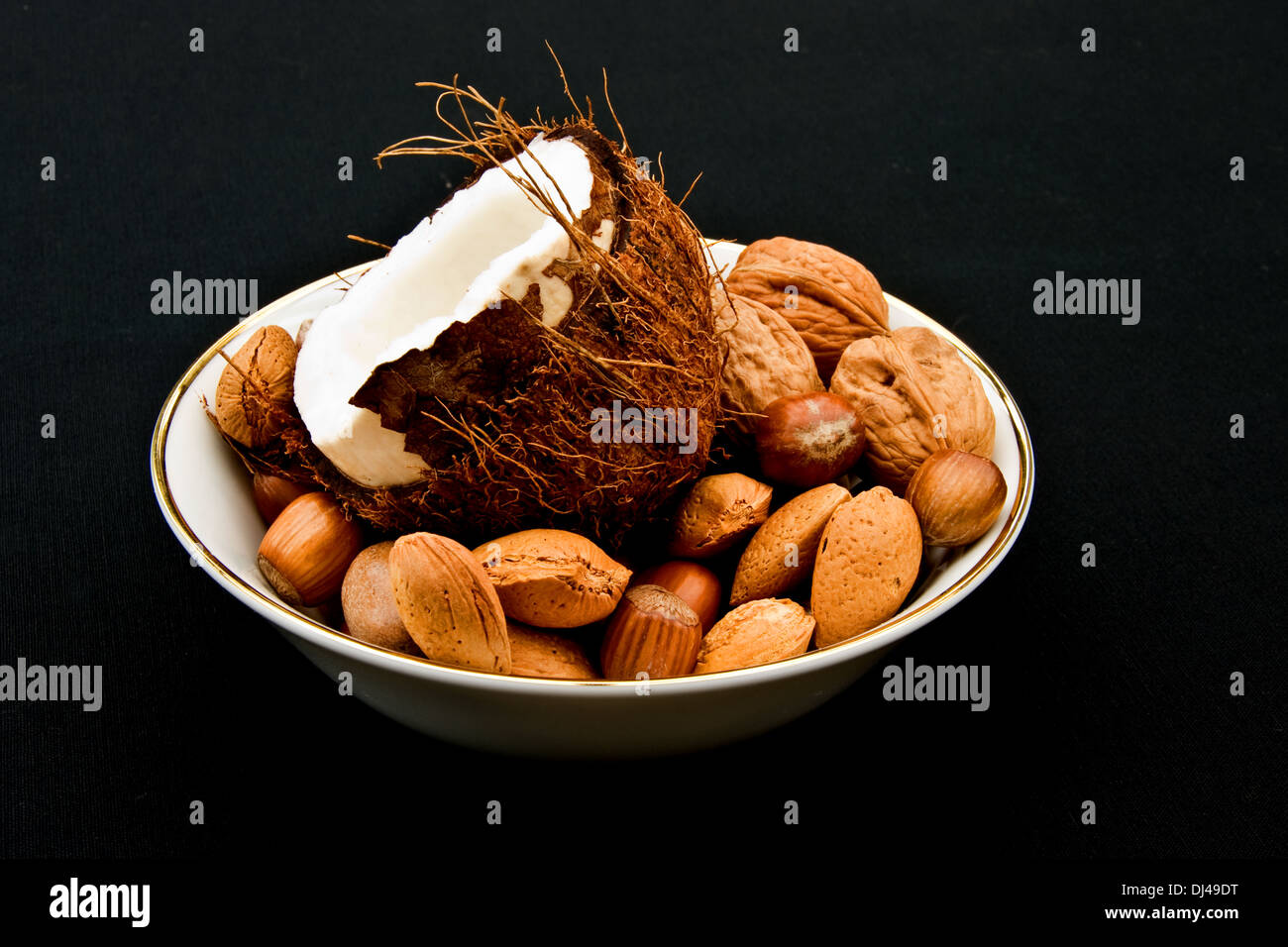 Selection of nuts in a dish Stock Photo - Alamy
