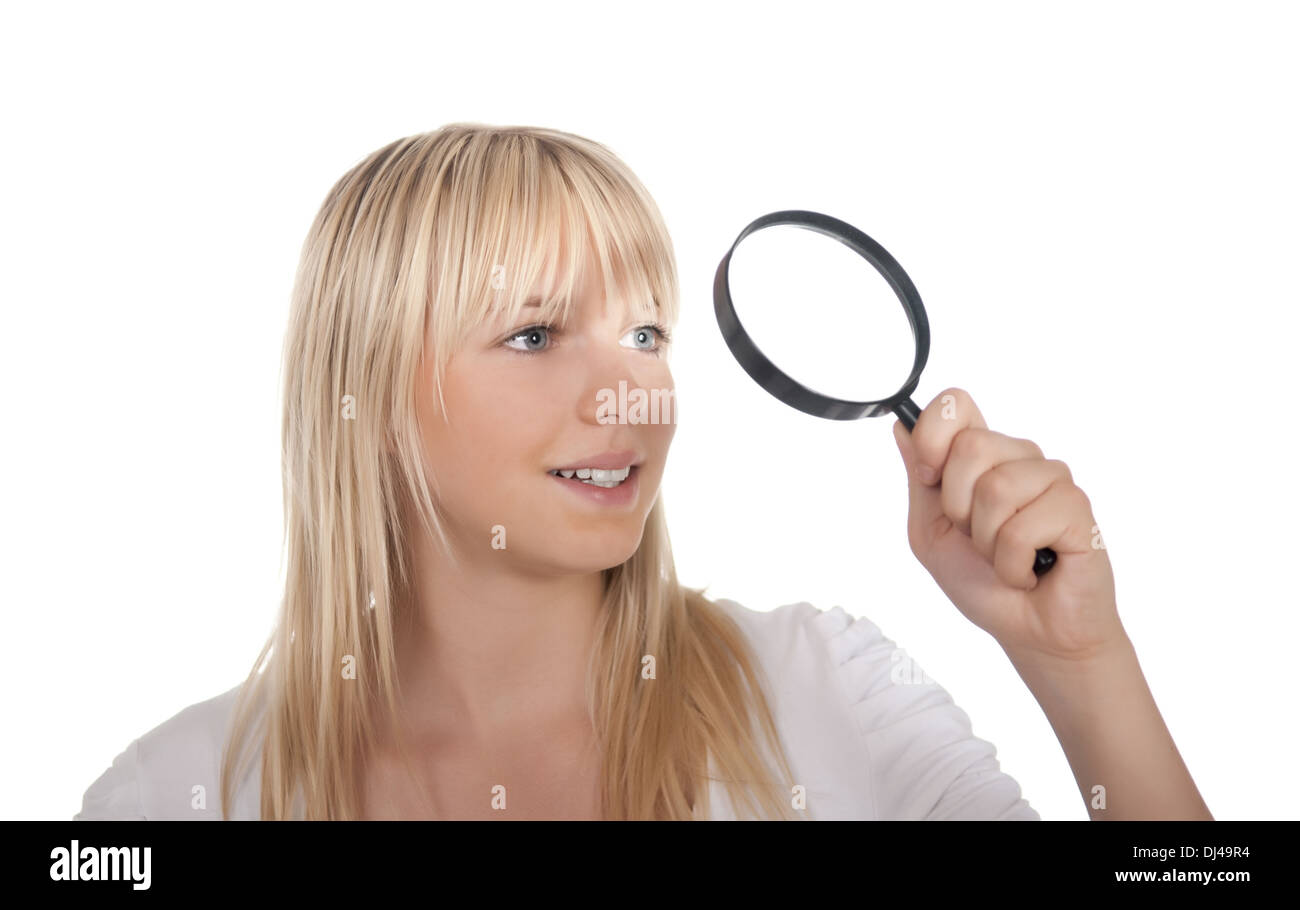 pretty blond young woman with magnifying glass Stock Photo - Alamy