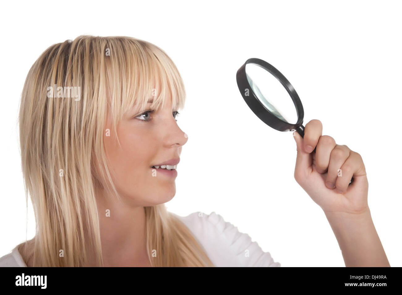 pretty blond young woman with magnifying glass Stock Photo - Alamy