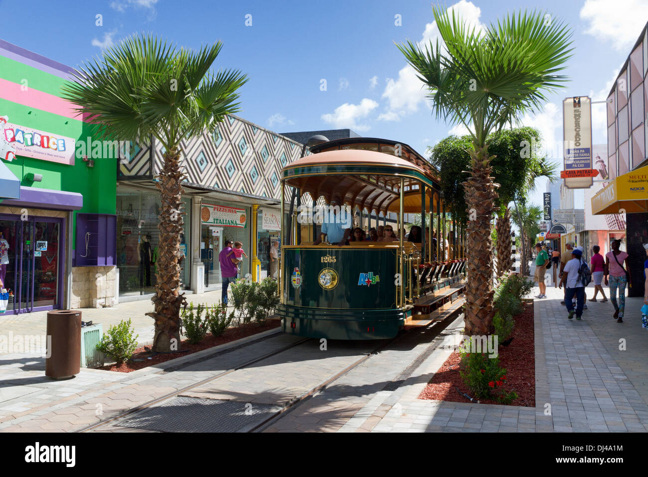 Tram runs through Oranjestad in Aruba Stock Photo - Alamy
