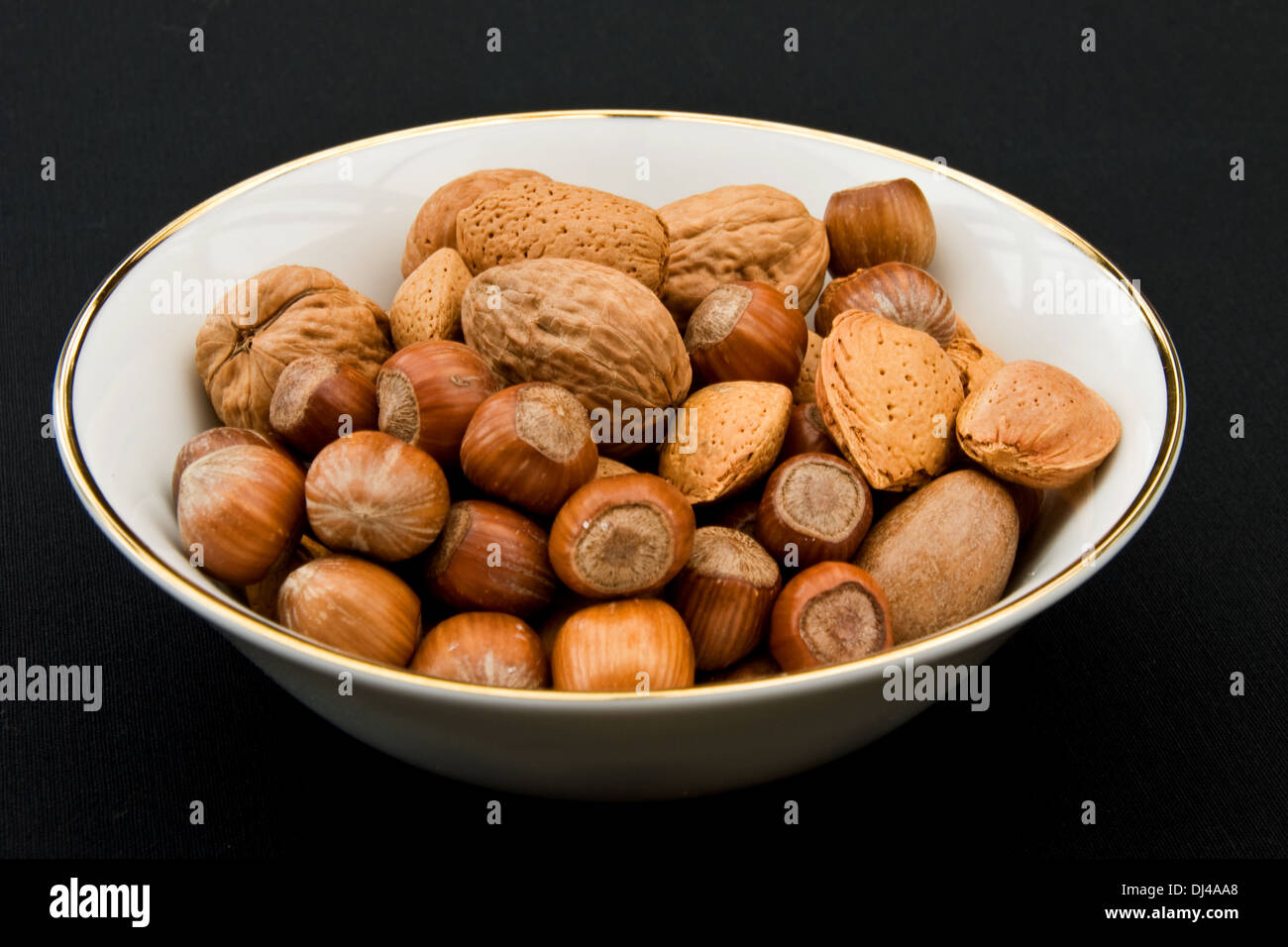 Selection of nuts in a dish Stock Photo - Alamy