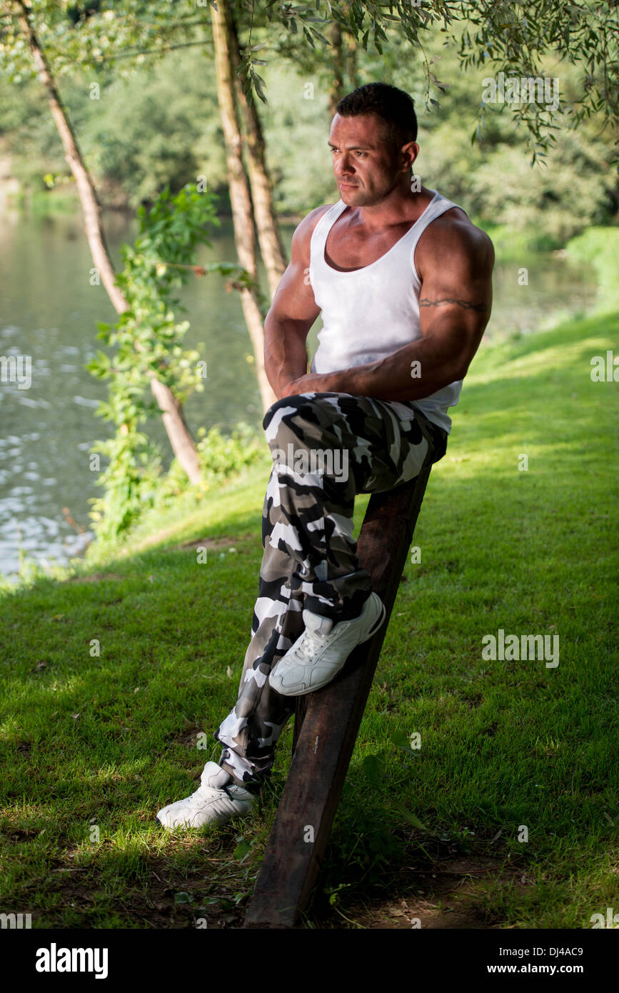 Bodybuilder Posing In A Field Stock Photo - Alamy