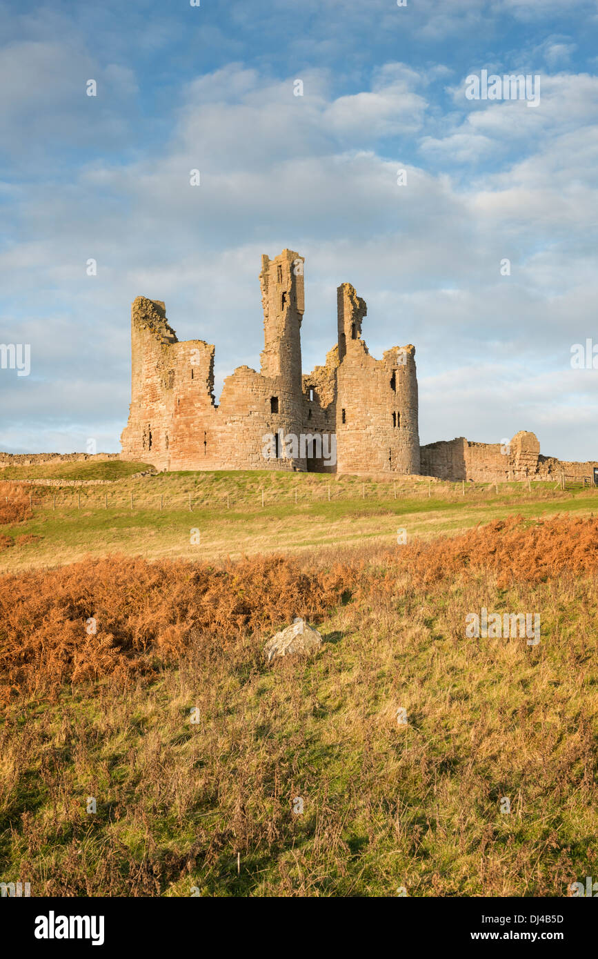 Dunstanburgh Castle in evening sunlight Stock Photo - Alamy