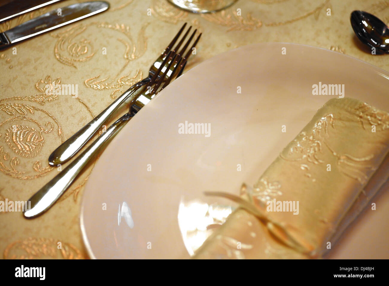 Fork and knife on a dinner table in a restaurant Stock Photo - Alamy