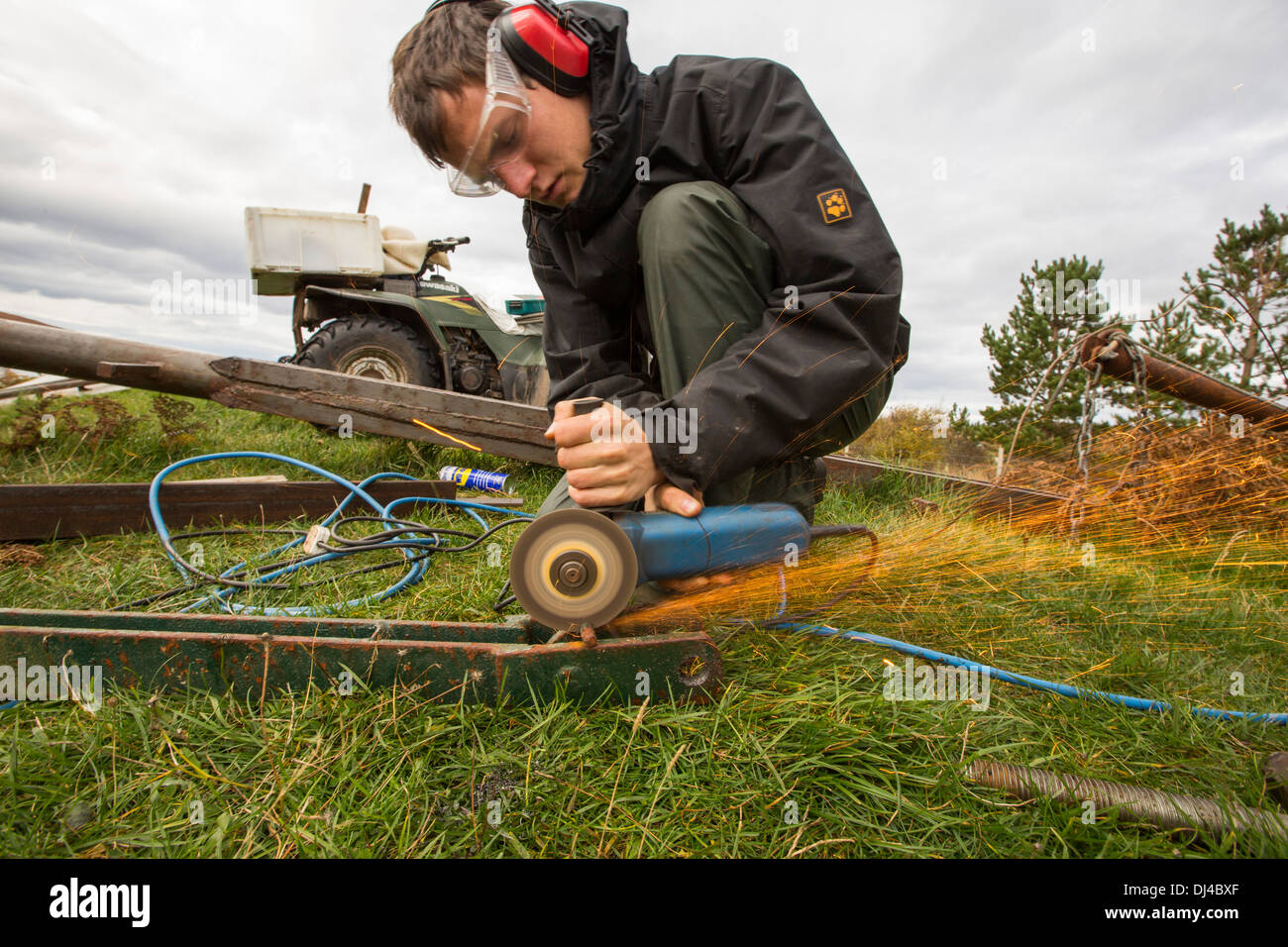 Hugh Piggott doing maintenance on his home made wind turbines in ...