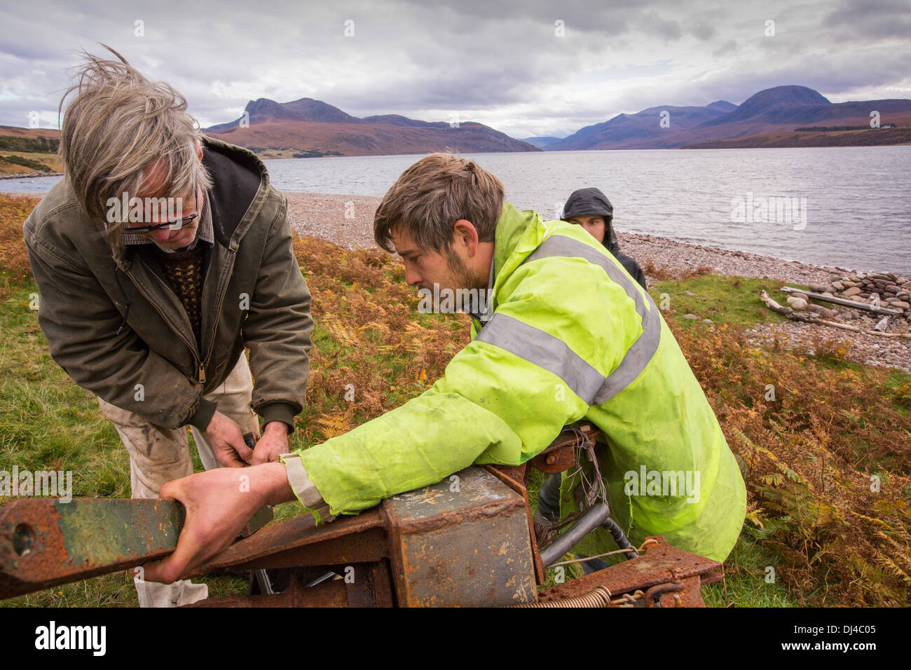 Hugh Piggott doing maintenance on his home made wind turbines in ...