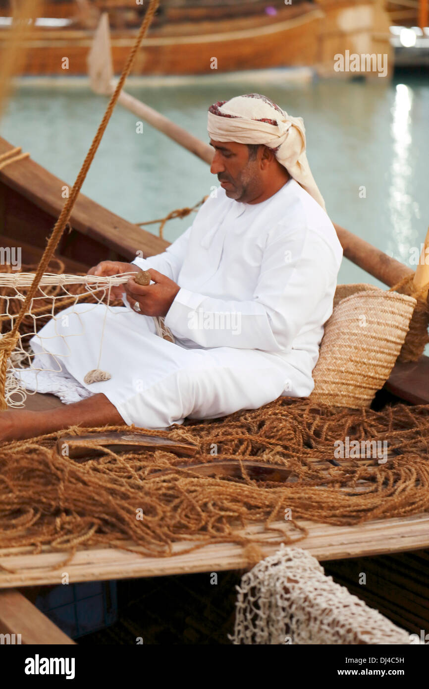 DOHA, Qatar - Nov 21 2013: An Omani fisherman demonstrates the art of ...