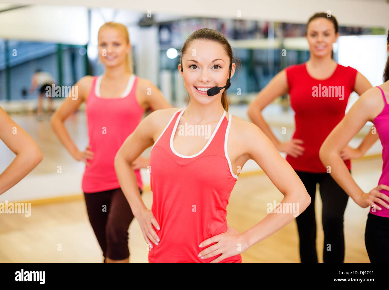 group of smiling people exercising in the gym Stock Photo - Alamy