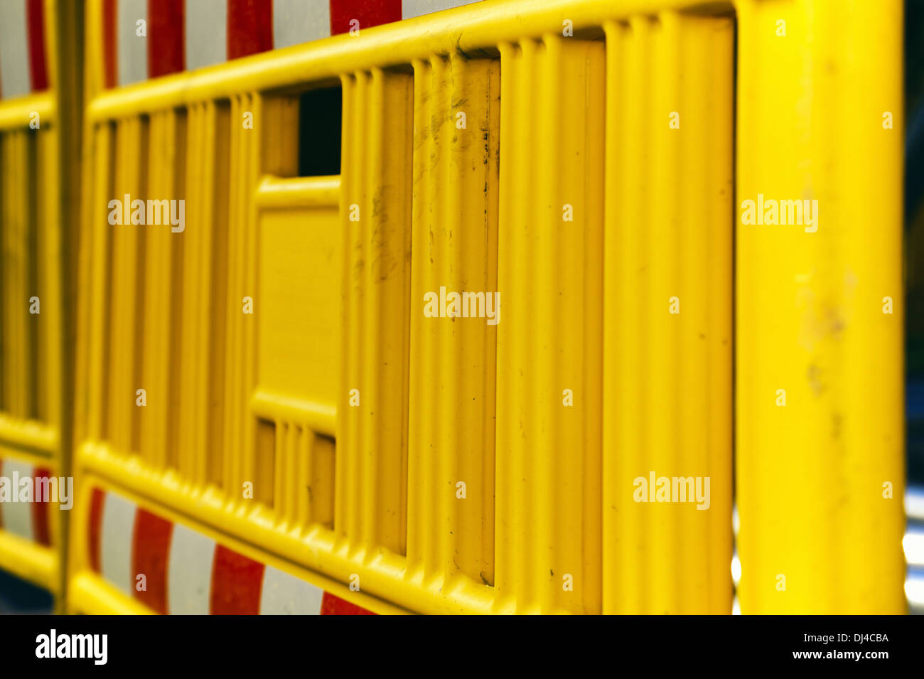 yellow construction fence Stock Photo - Alamy