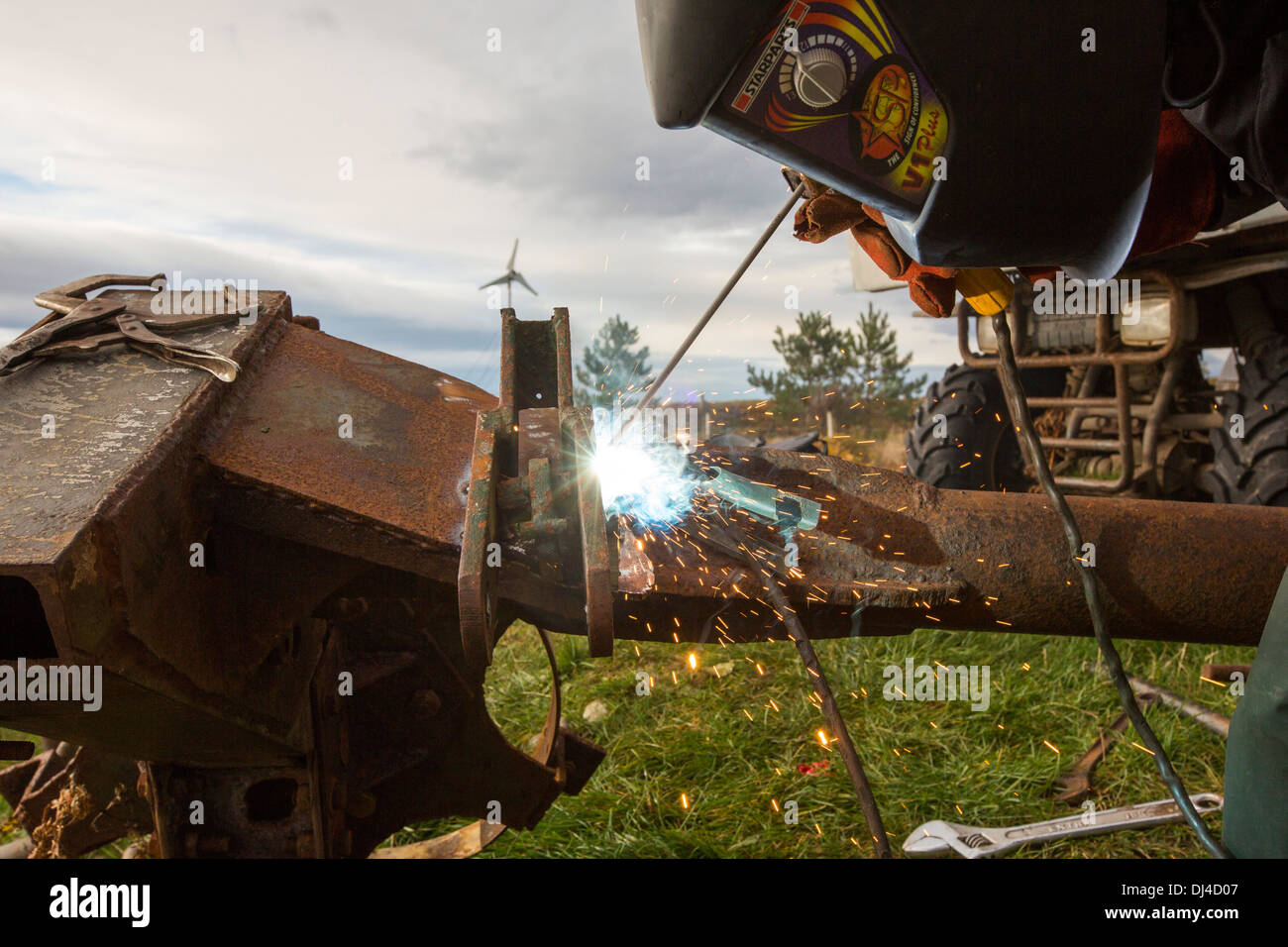 Hugh Piggott doing maintenance on his home made wind turbines in ...